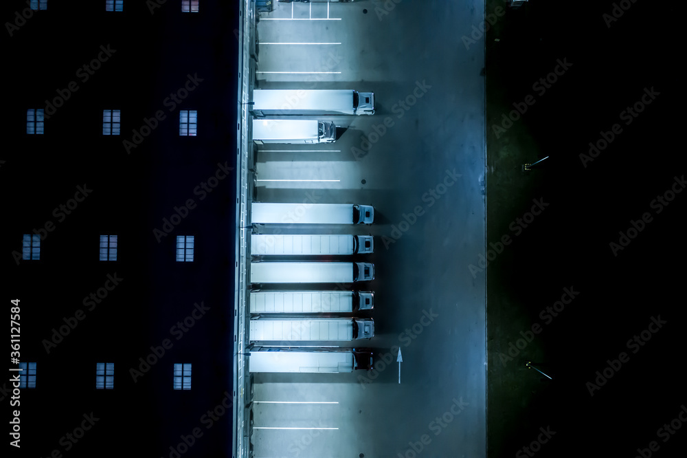 Night Loading dock at a warehouse. modern logistics center. docking ...