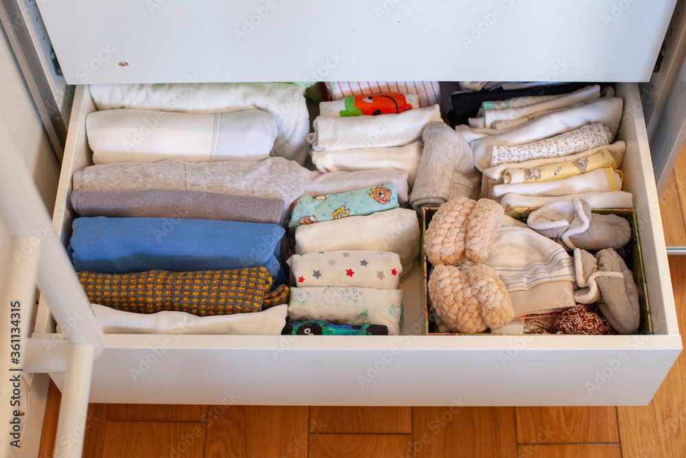 Vertical storage of clothing. Clothing folded for vertical storage in ...