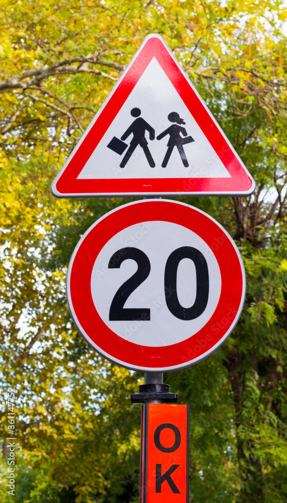 Road signs "Beware of children" and "Speed limit 20 km/h" against the ...