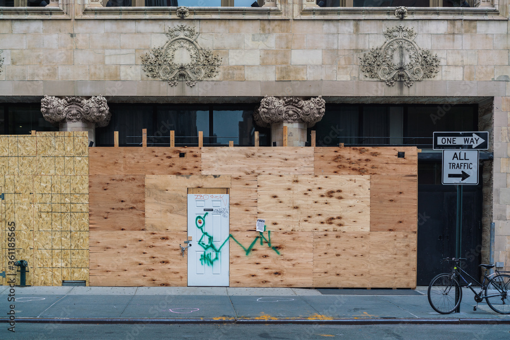 NYC retailer small business boarding up their storefronts with plywood ...