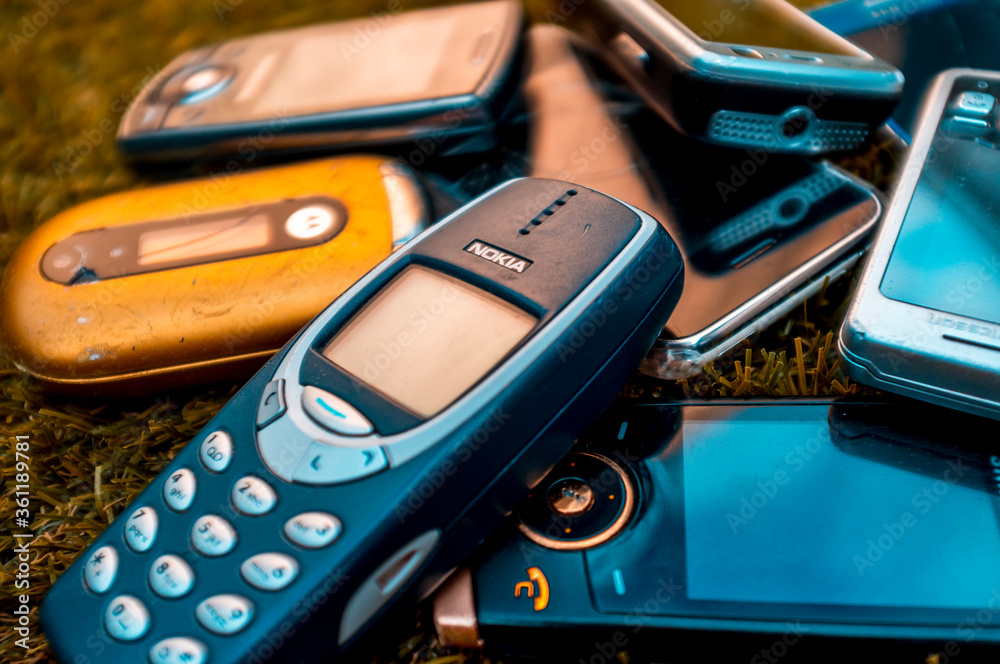 London, England - July 12, 2019: Selection of old mobile cell phones ...