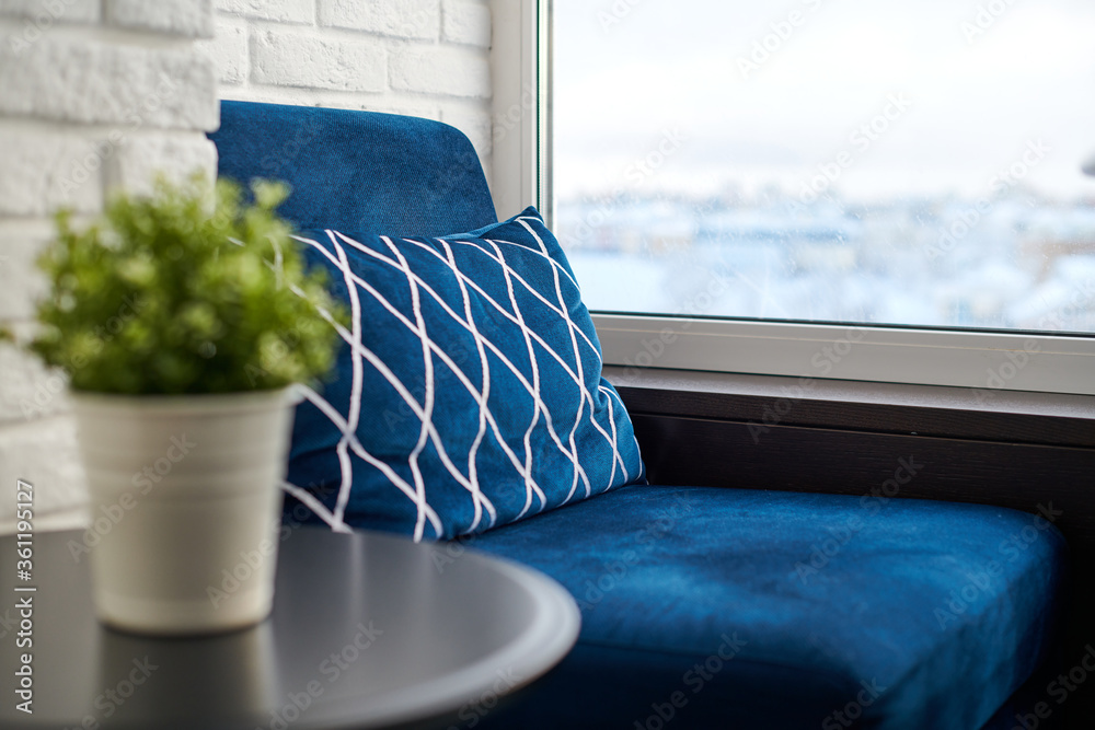 Modern loft apartment with sofa and window view on cityscape. Stock ...