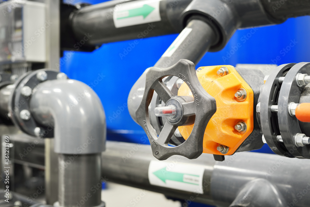 PVC pipeline an industrial city water treatment boiler room. Valves and ...