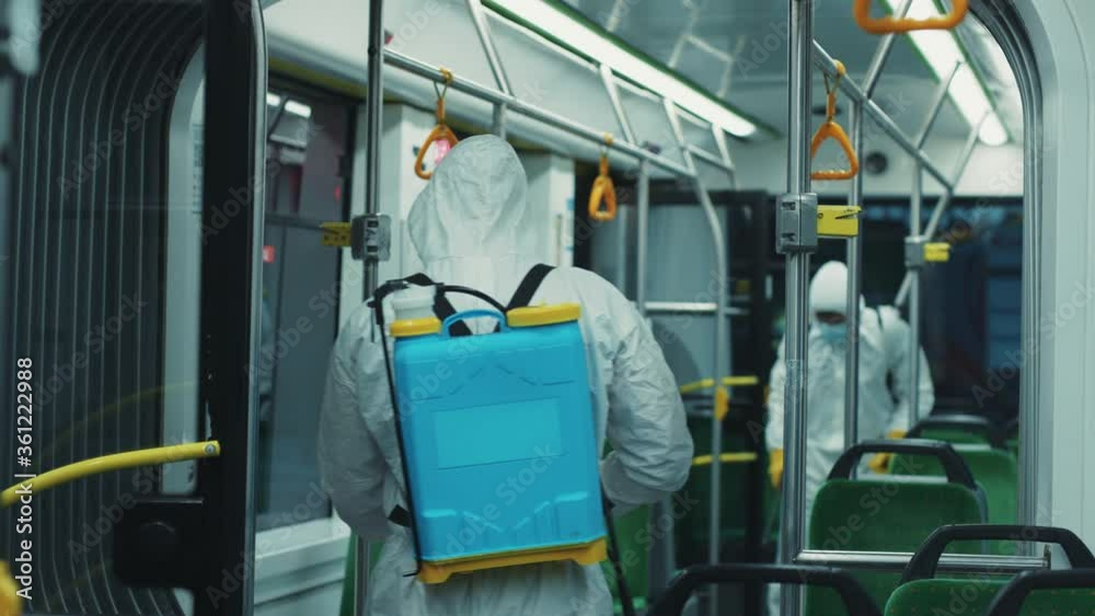 Covid-19. Pandemic. Team of professional sanitary workers in white ...