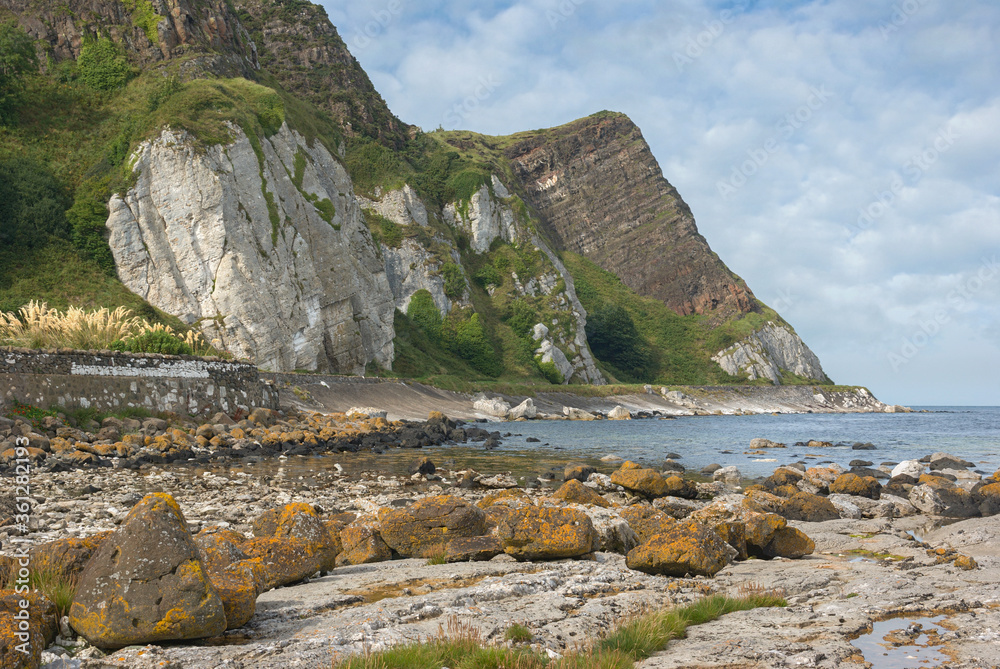 Typical view of the scenic Antrim coast in Northern Ireland. The rocky ...