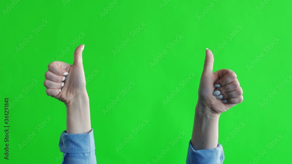 Thumbs up sign hand gesture on green screen. Simbol of approval like ...