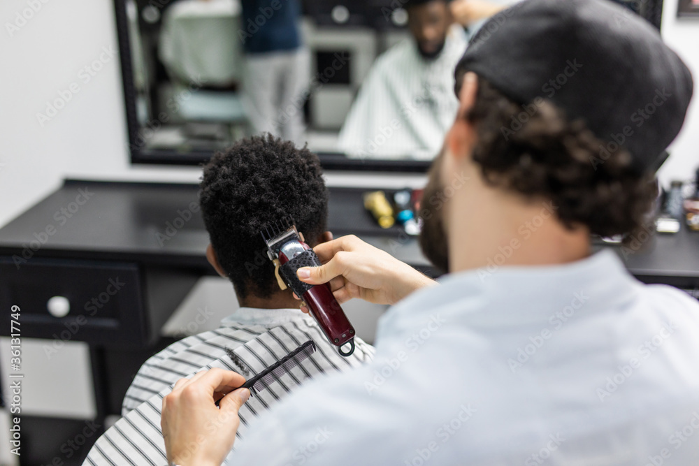 Side view of serious man with stylish modern haircut looking forward in ...