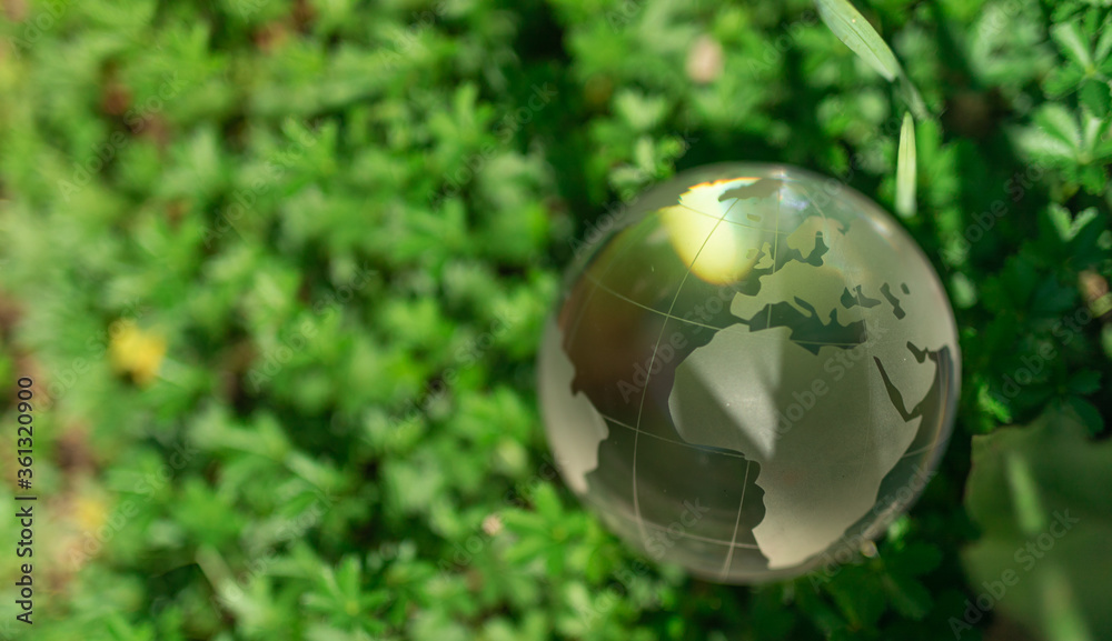 earth green concept glass sphere. Stock Photo | Adobe Stock