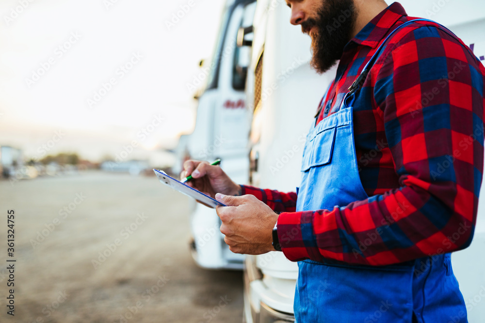 Truck inspection and safety, Truck driver daily checking the semi truck ...