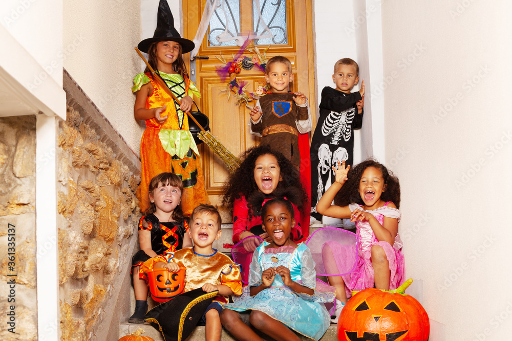 Halloween group kids portrait sit together boys with girls on the ...
