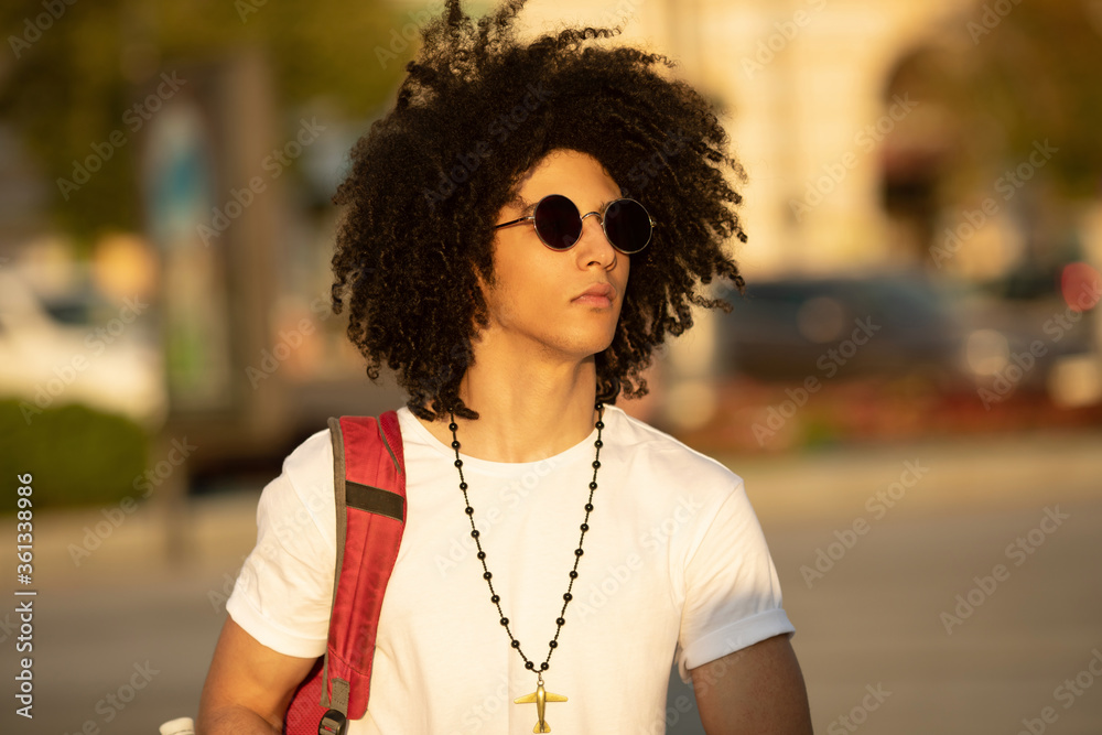Arabian model looking young guy looking to camera. Man with Curly hair ...