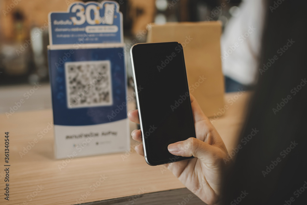 hand customer using digital mobile phone scan QR code paying for buying ...