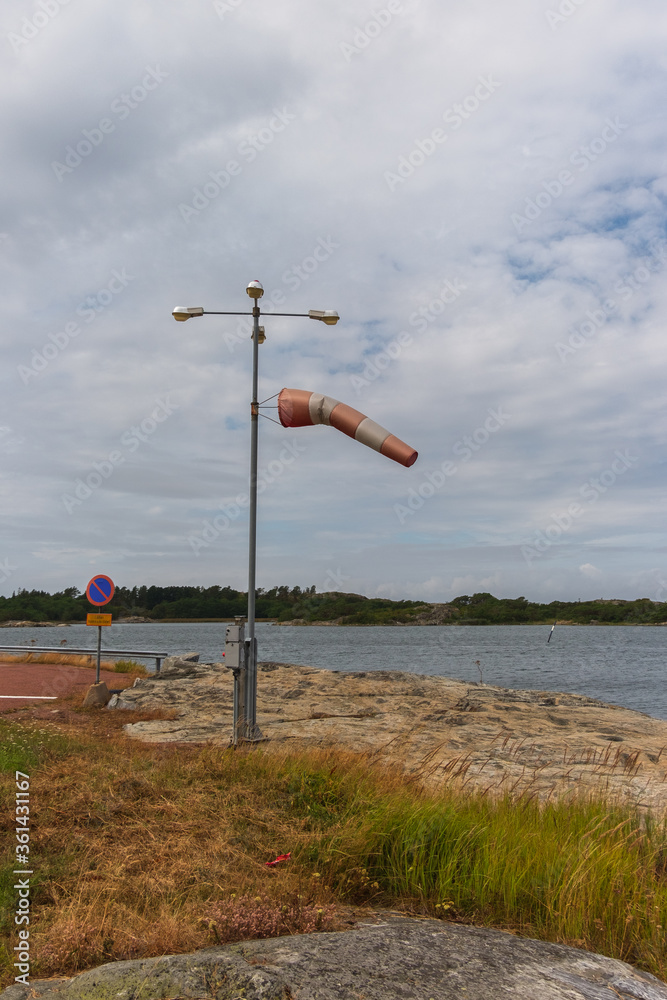 a wind-blown port flag showing the direction and approximate strength ...
