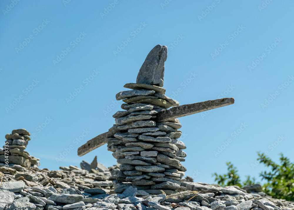 beautiful white stone piles by the sea, these objects were built by ...