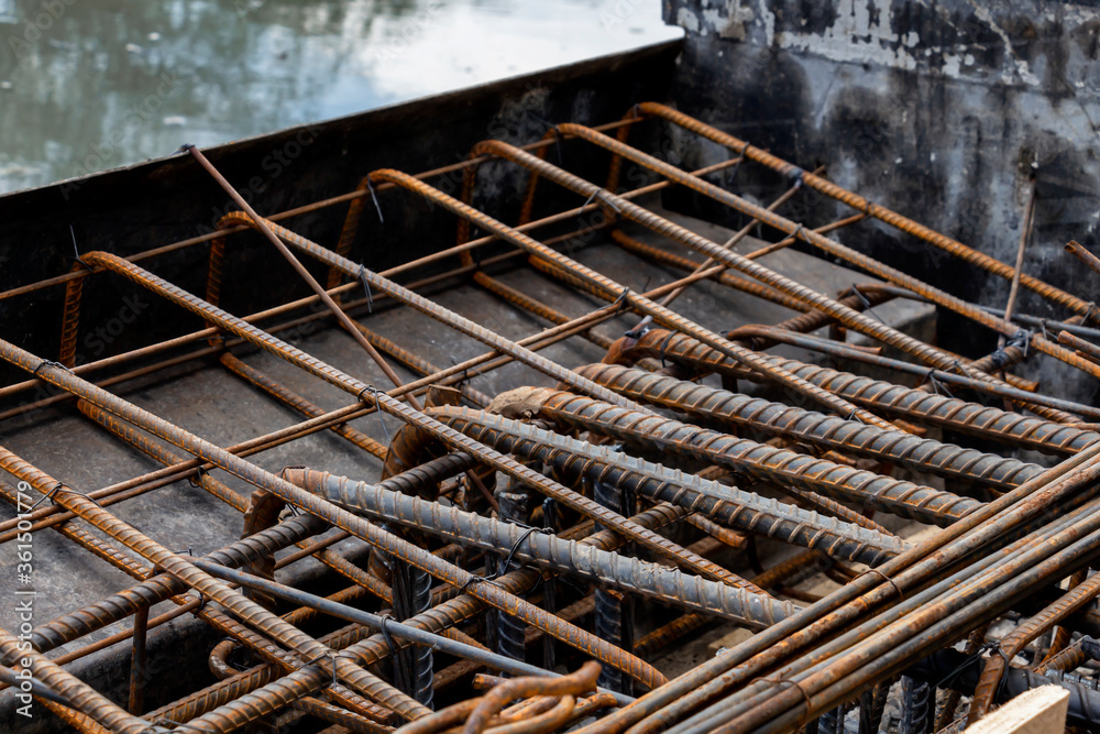 Rebar tie wire work at construction site. Steel bars reinforcing for ...