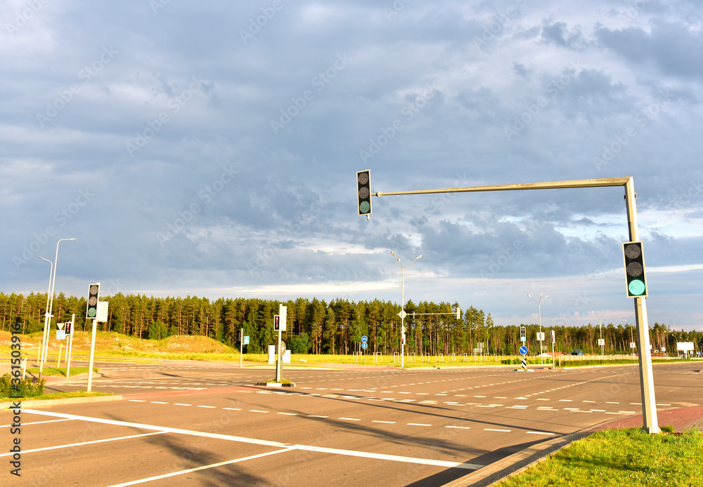 Green traffic signal at road. Traffic light control and coordination ...