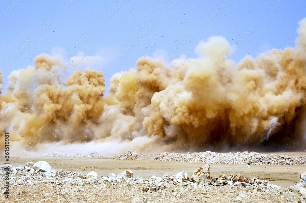 Dolomite rock dust after detonator blasting in the desert Stock Photo ...