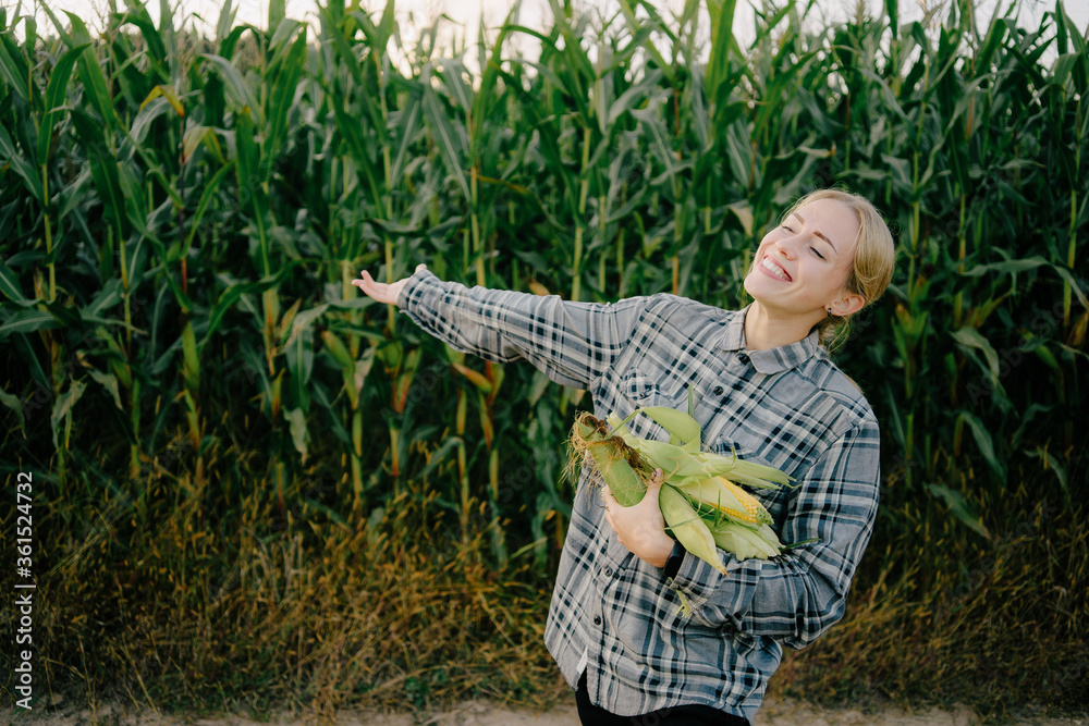 Cute Girl with beautiful smile and bunch of corn in her hands, happy ...