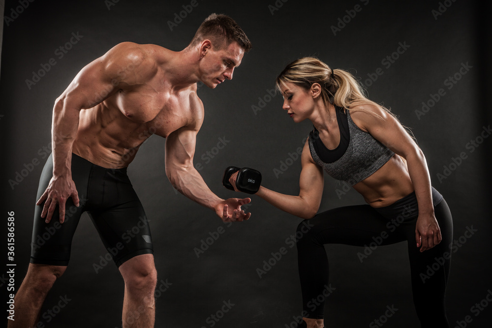 Fitness in gym, sport and healthy lifestyle concept. Couple of athletic ...