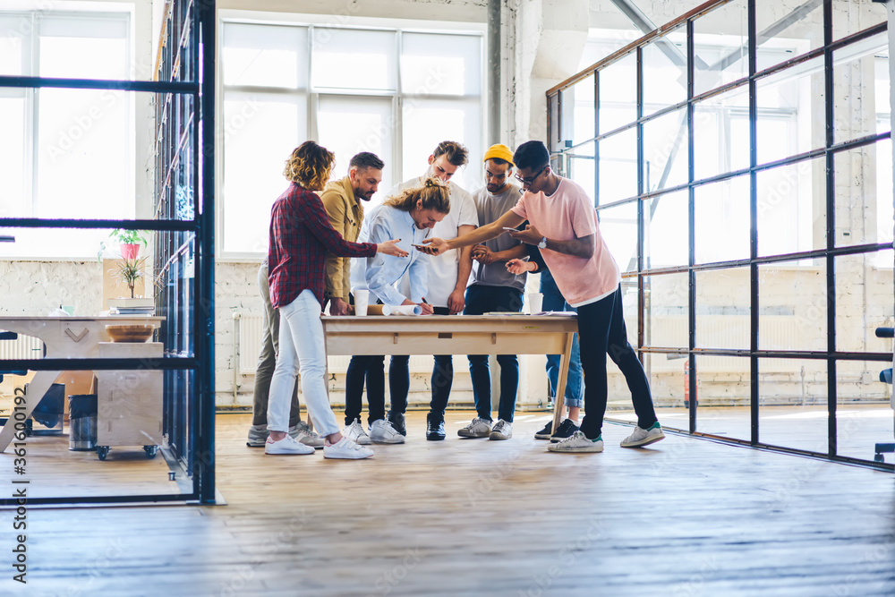 Crew of professional architects analyzing information and accountings ...