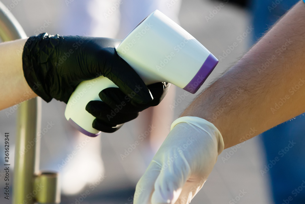 Gloved control for monitoring body temperature with a digital non ...