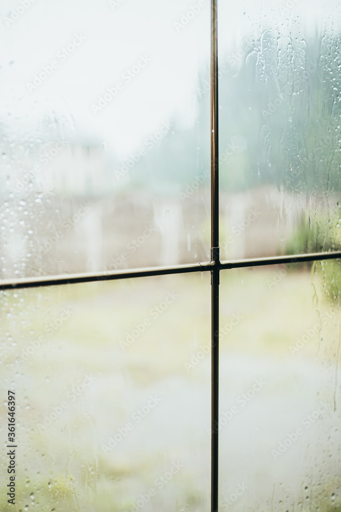 Cloudy rainy weather outside the window - blurry drops - sad mood of ...