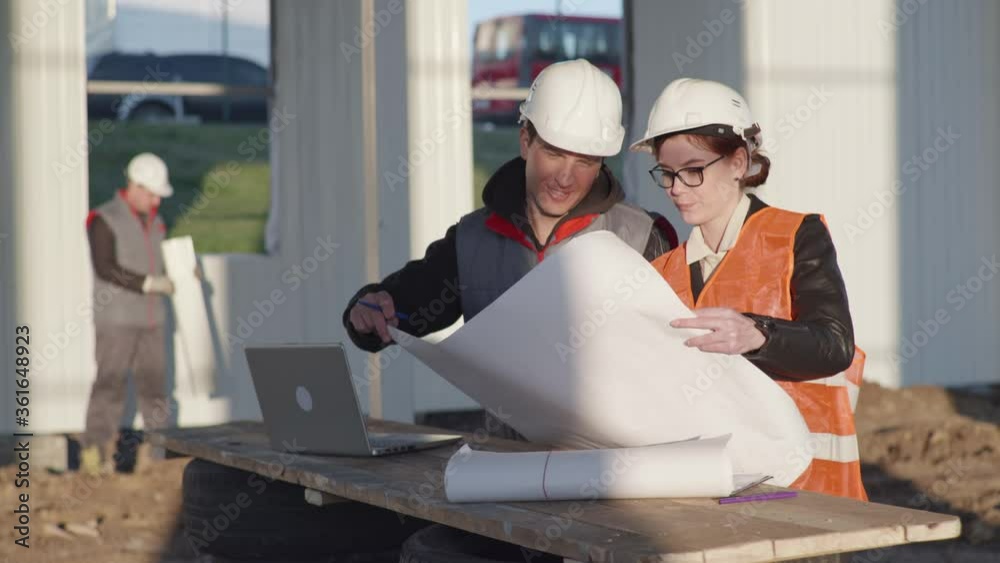 work of an architect and engineer browsing building project of an ...