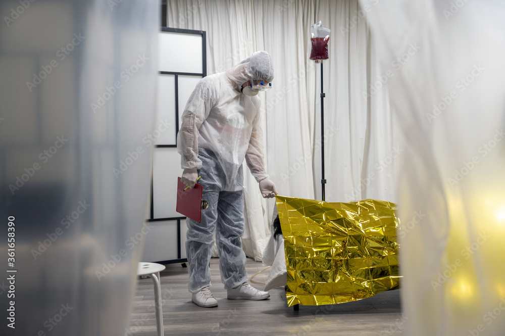 Lifeless body of a person inside a hospital field tent for the first ...