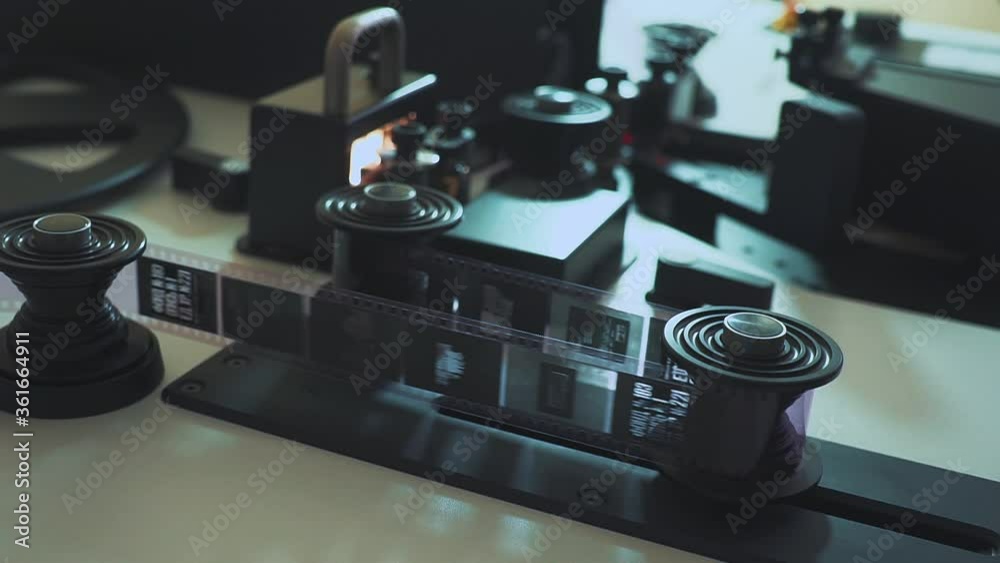 Old movie film strip. scanner is scanning 35 mm film to digital ...