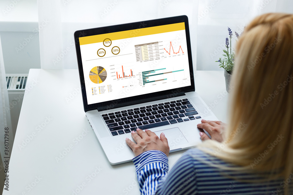 Laptop on table showing charts and graph, Analysis Business Accounting ...
