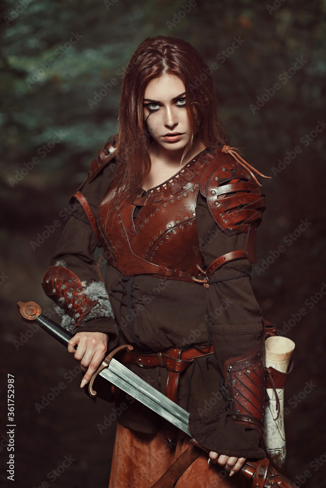 Beautiful female warrior with leather armor Stock Photo | Adobe Stock