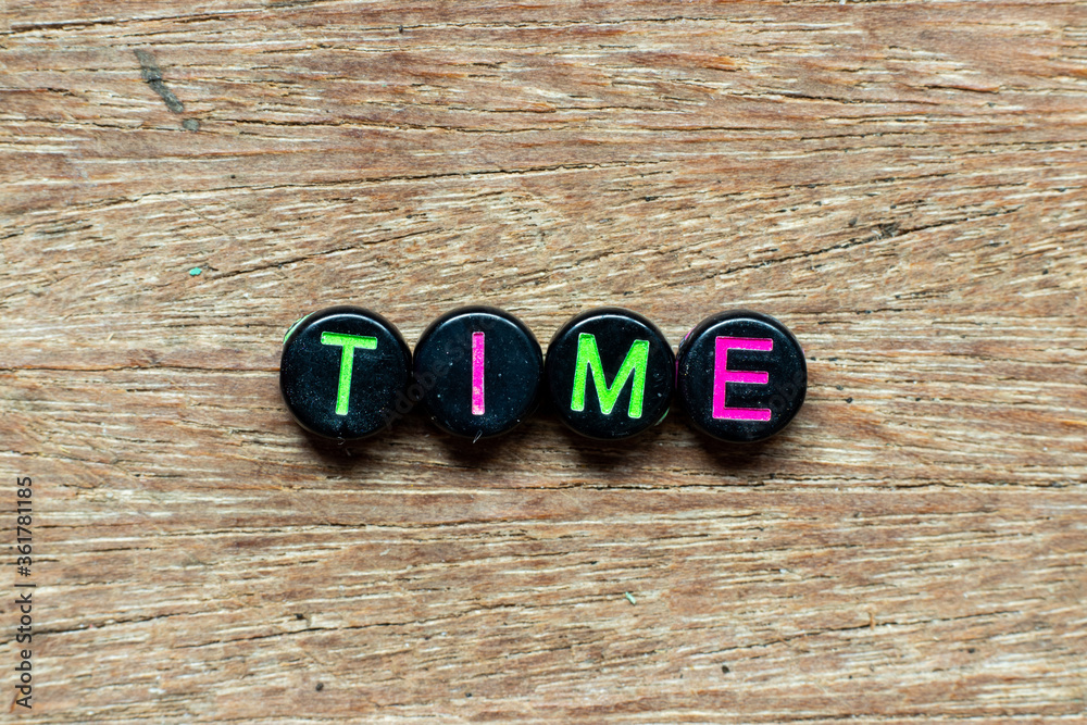 Black bead with color letter in word time on wood background Stock ...