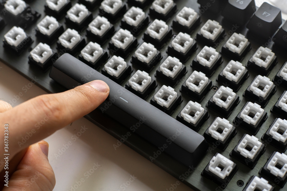 gamer push the button on a mechanical keyboard with mechanical switches ...