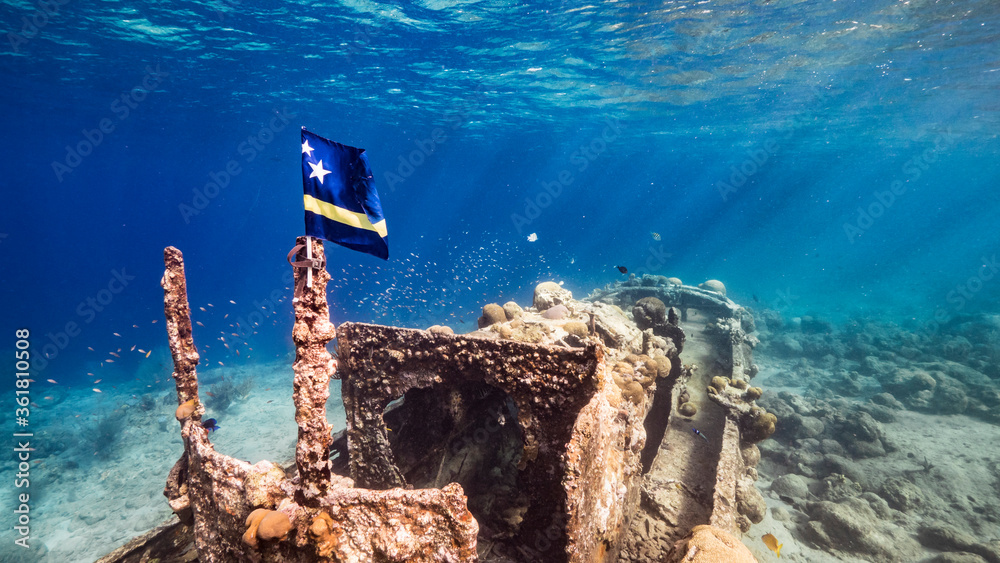 Ship wreck "Tugboat" in shallow water of coral reef in Caribbean sea ...