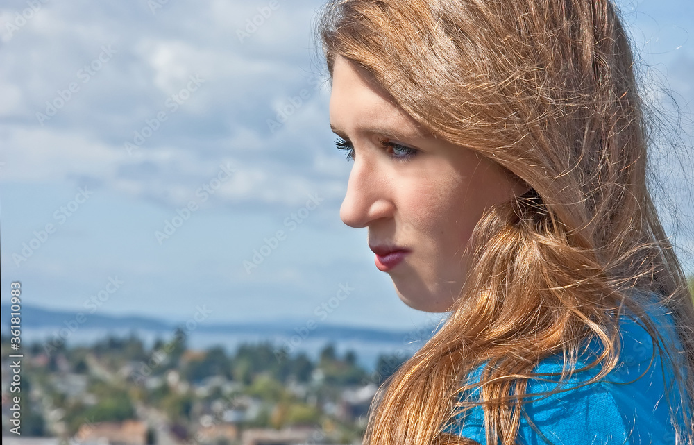 This is a portrait of a pretty Caucasian 17 year old teen girl. She's ...