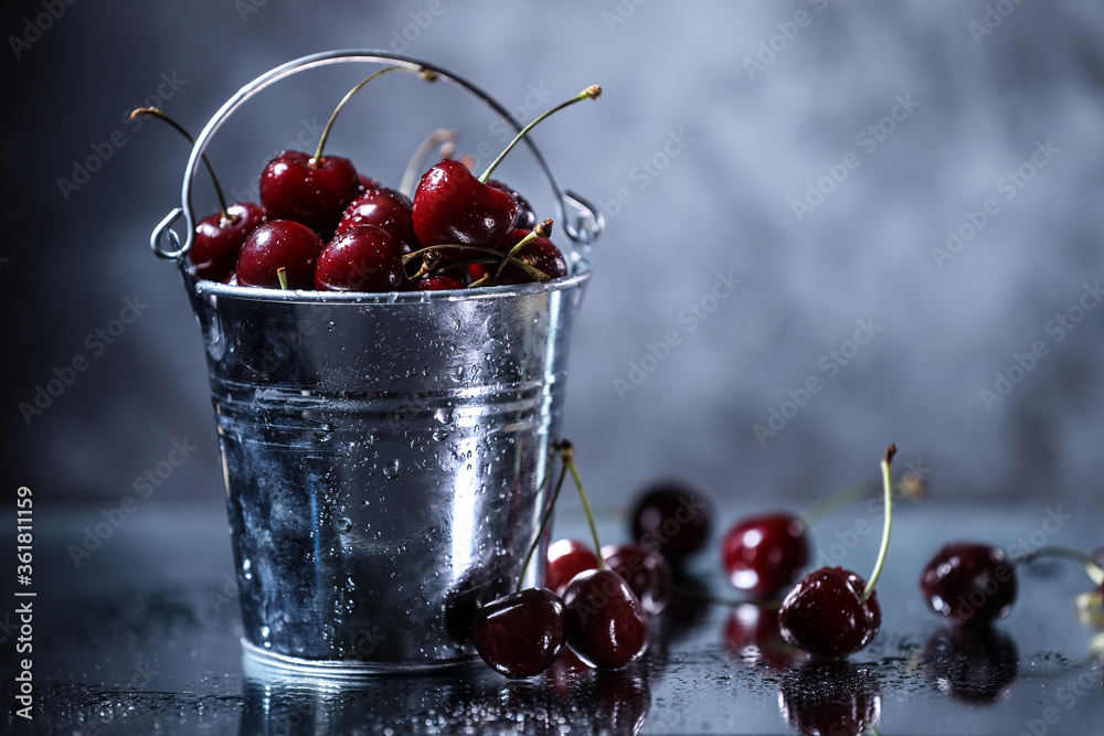 Red sweet cherries in a metal bucket on grey background. Summer taste ...