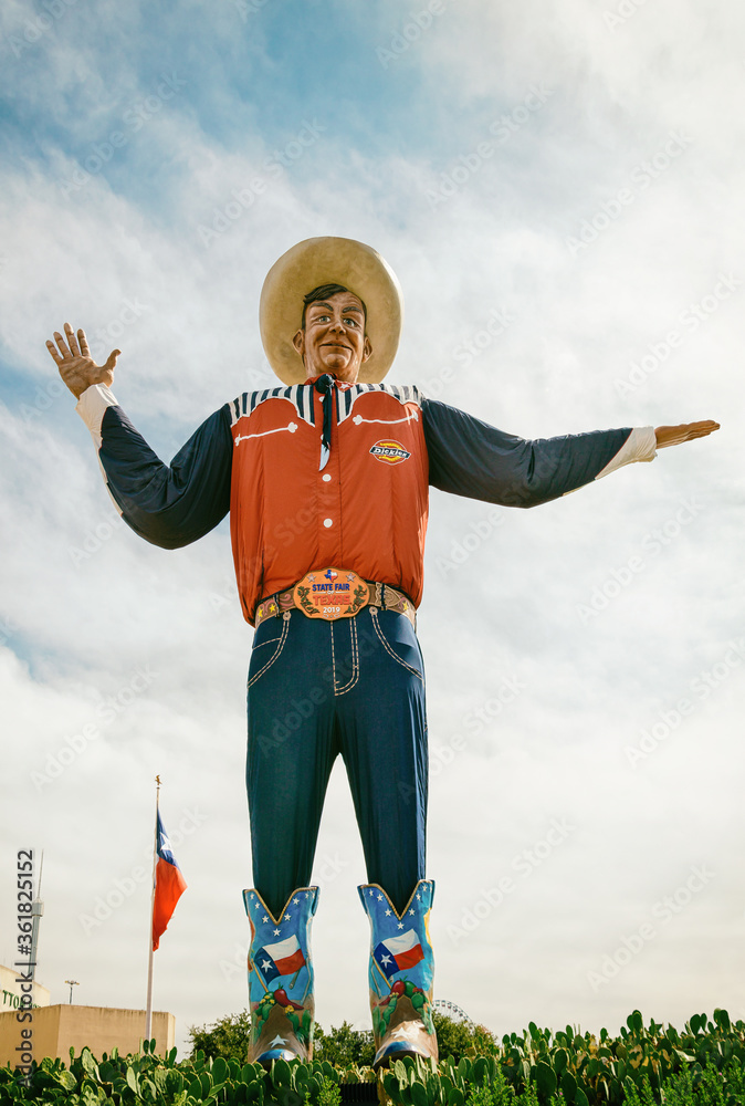 Big Tex statue standing tall at Fair Park. The icon greets and waves ...