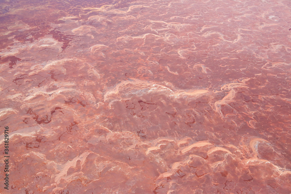 Aerial view of the salt pan and mineral crust with red algae of Lake ...