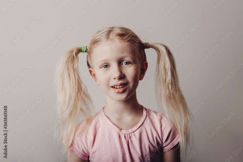 Closeup portrait of surprised sad blonde Caucasian preschool girl in ...