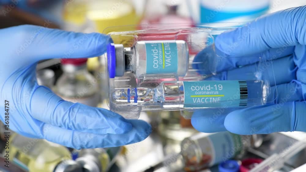 hand of scientist doctor holding vial ampoule bottle human use vaccine ...