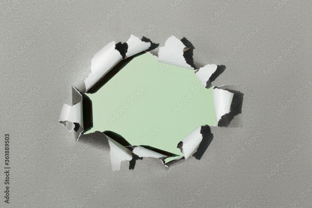 Hole in paper with green background. Ripped torn paper texture Stock ...