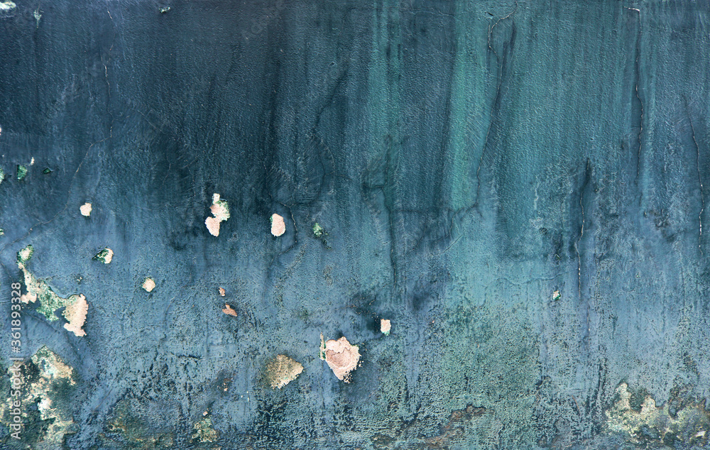 gradient from prussian blue to turquoise wall with peeling paint and ...