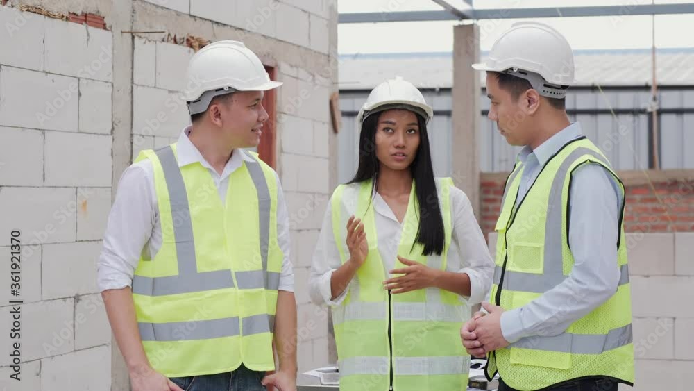 Team asian engineers working through construction site. Woman present ...