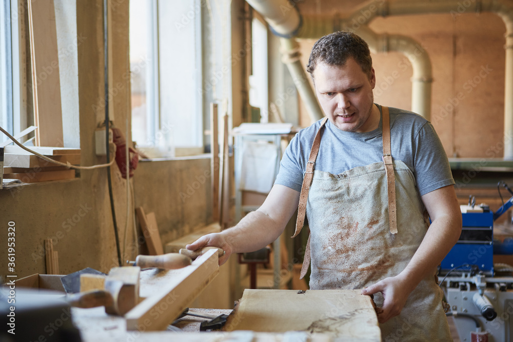 Carpenter in woodworking in the carpentry Stock Photo | Adobe Stock
