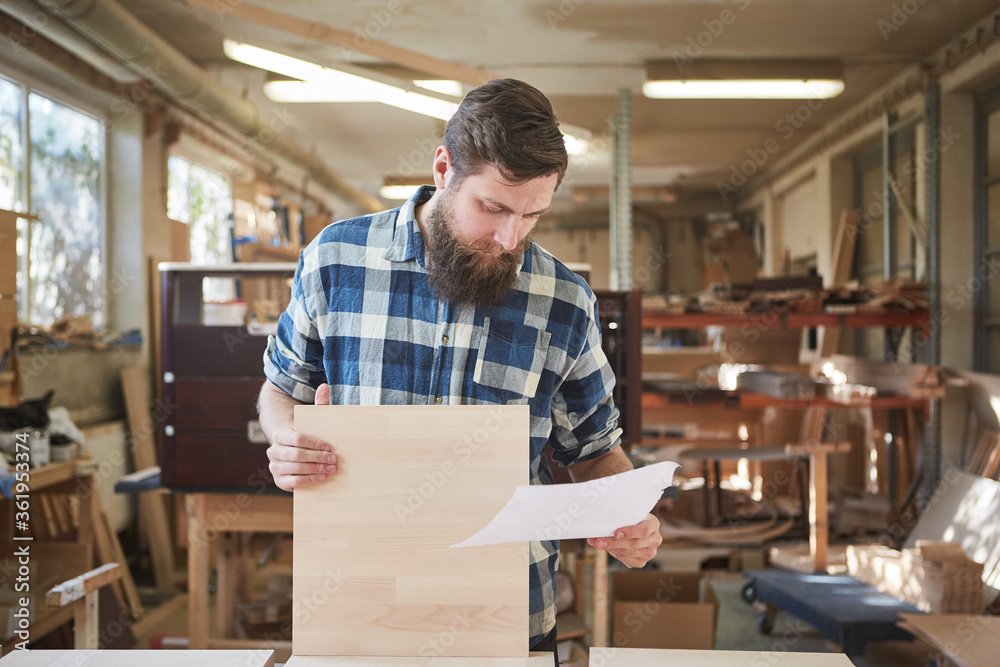 Carpenter with order on a sheet of paper Stock Photo | Adobe Stock