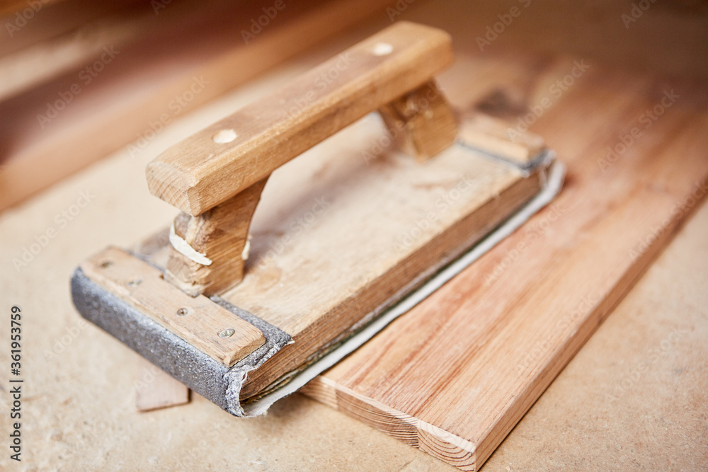 Hand grinder with sandpaper as a hand tool Stock Photo | Adobe Stock