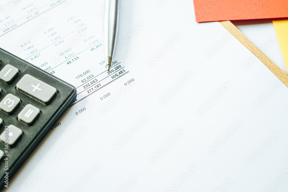 Financial calculation numbers chart with pen, calculator and post it ...