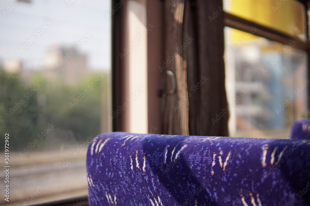 Inside of train with seat and sunshine through window Stock Photo ...