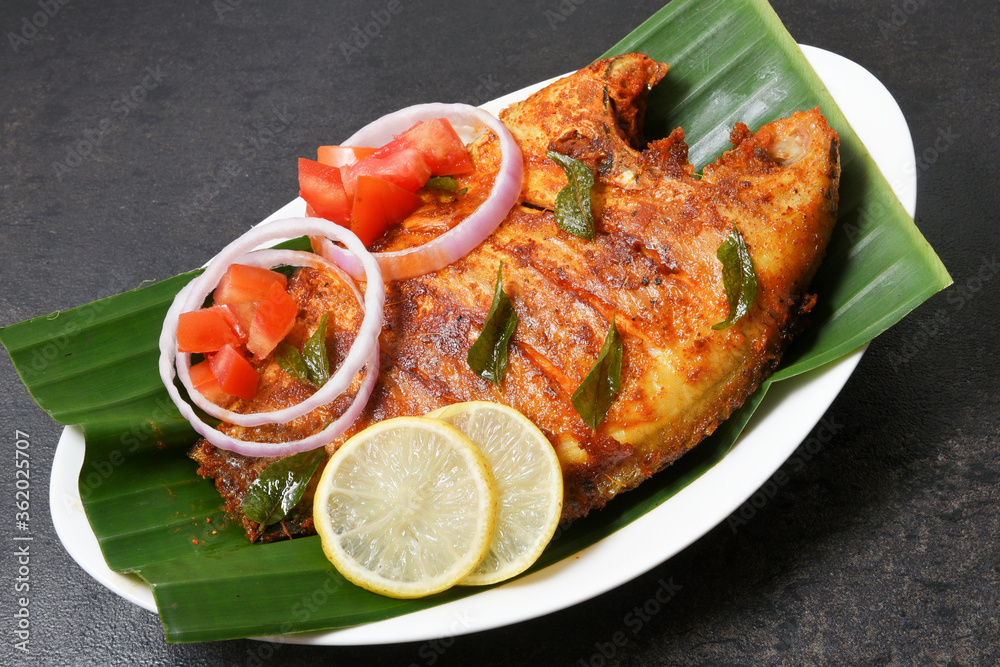 Kerala fish curry, Karimeen Pollichathu a popular hot and spicy baked ...