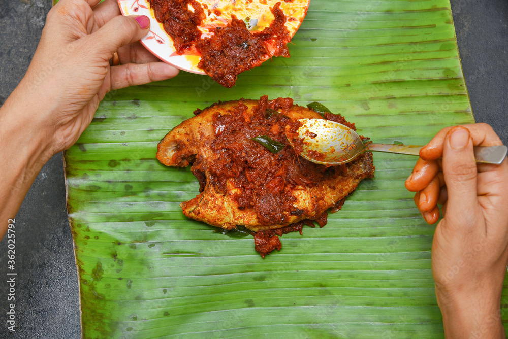 Kerala fish curry, Karimeen Pollichathu a popular hot and spicy baked ...